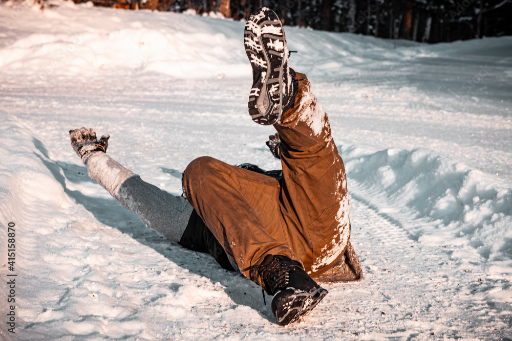 person laying on the ground on his back after he slipped and falled ...