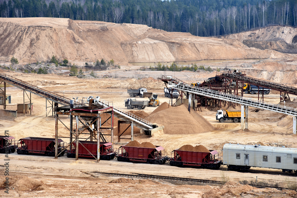 Loading sand into freight cars of a train in quarry. Sand Making Plant ...