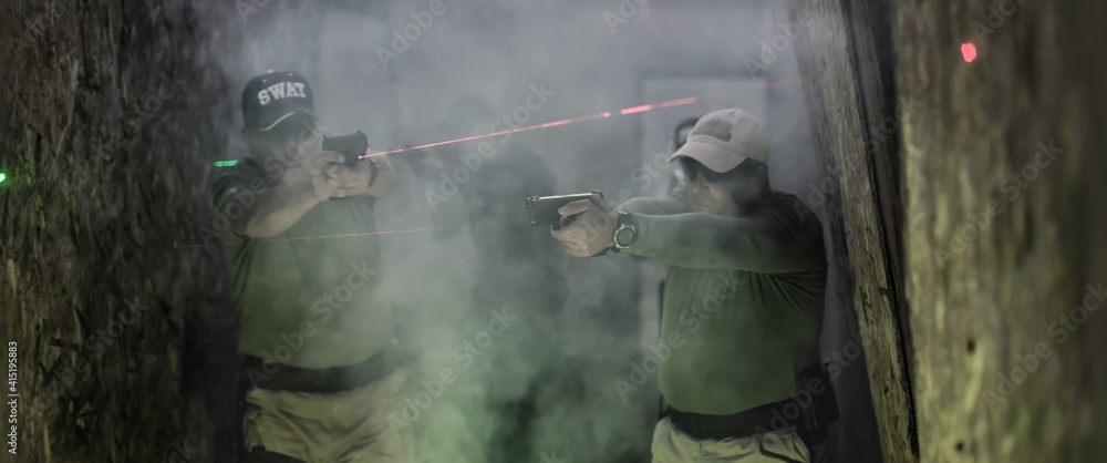 Army soldier in action aiming at weapon laser sight optics. Shooting ...