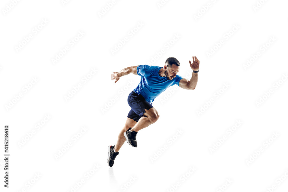 In air. Caucasian professional male athlete, runner training isolated ...