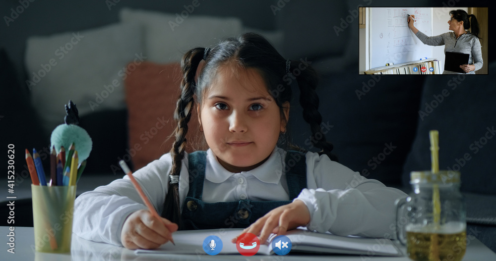 Cute schoolgirl girl child student who raises her hands at a distance ...