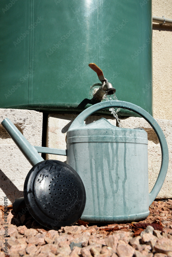 Ecological system for filling a watering can with rainwater from a ...