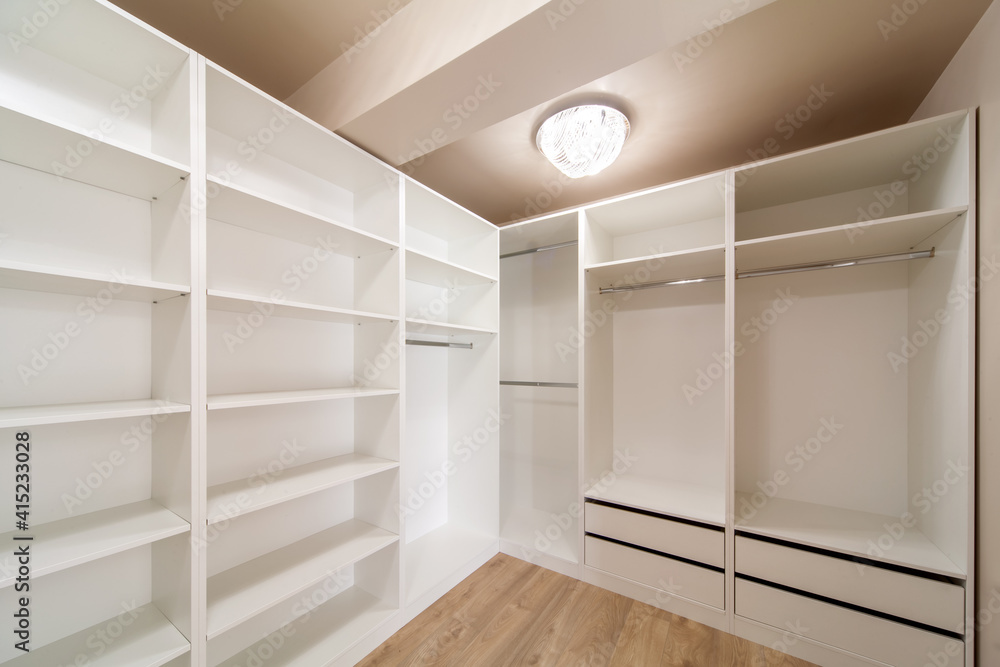 Big empty wardrobe in dressing room. Large wardrobe room, with empty ...