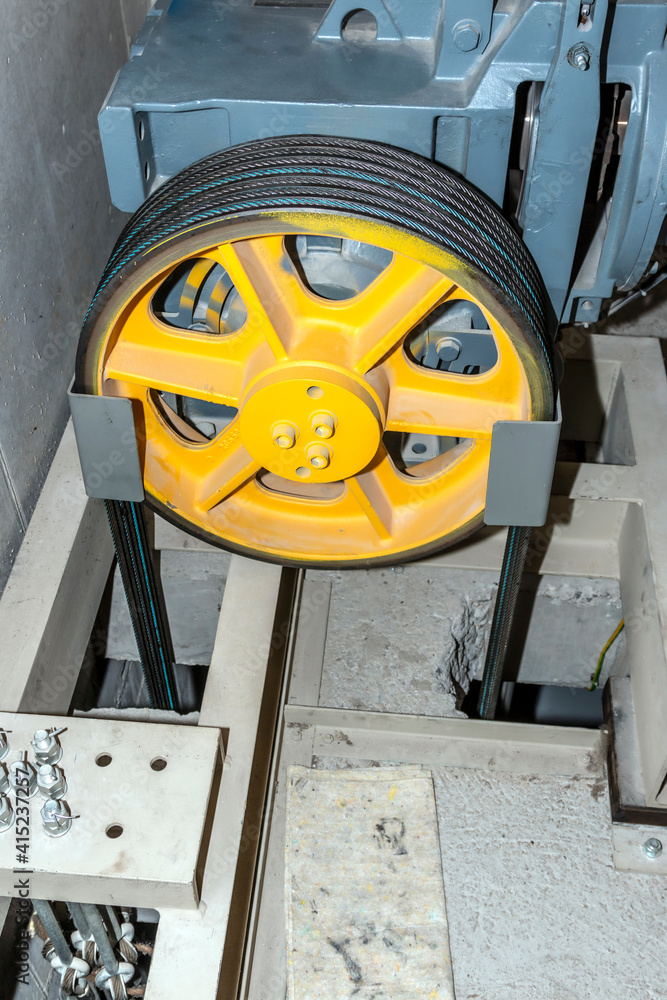 an electric elevator motor of a building elevator Stock Photo | Adobe Stock