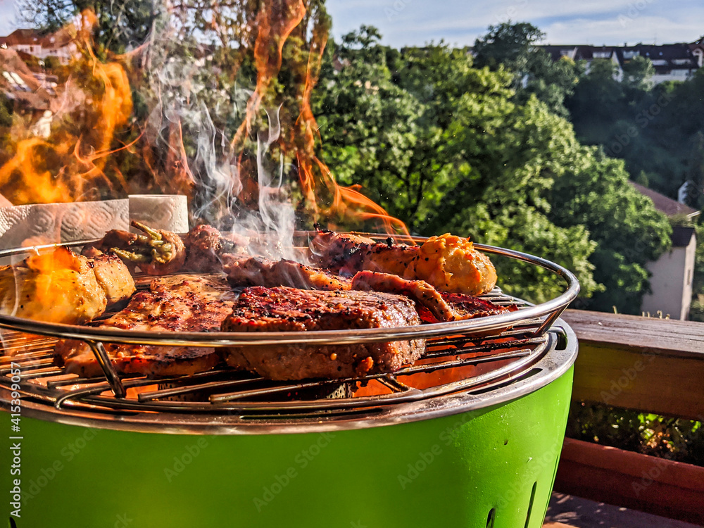 cooking on the fire grilled chicken and meat bbq flames fire lotusgrill ...