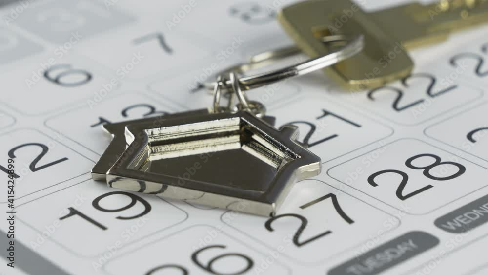 Calendar mark. House keys on calendar planner with circled number ...