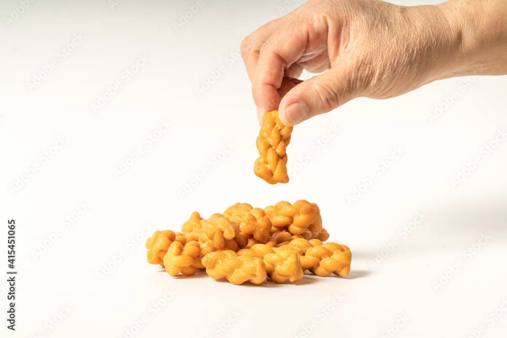 Traditional Chinese snack honey mahua on a solid color background Stock ...