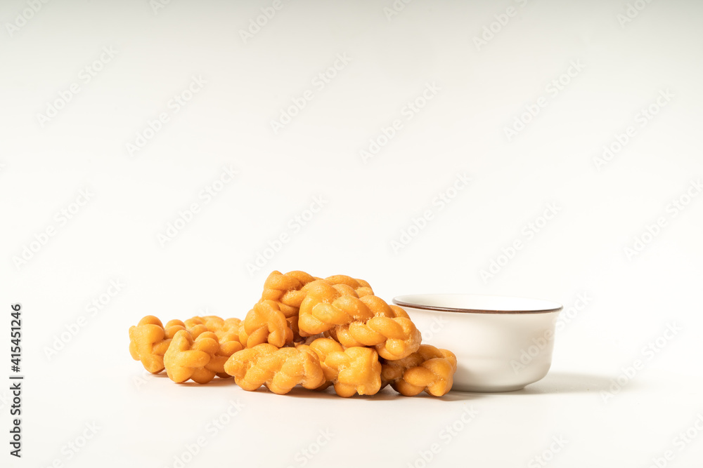 Traditional Chinese snack honey mahua on a solid color background Stock ...