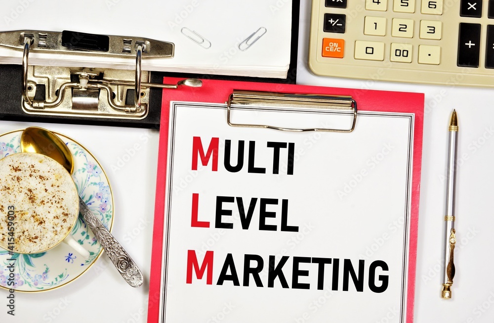 Foto de Multi-level marketing. A text label in a working notebook. The ...