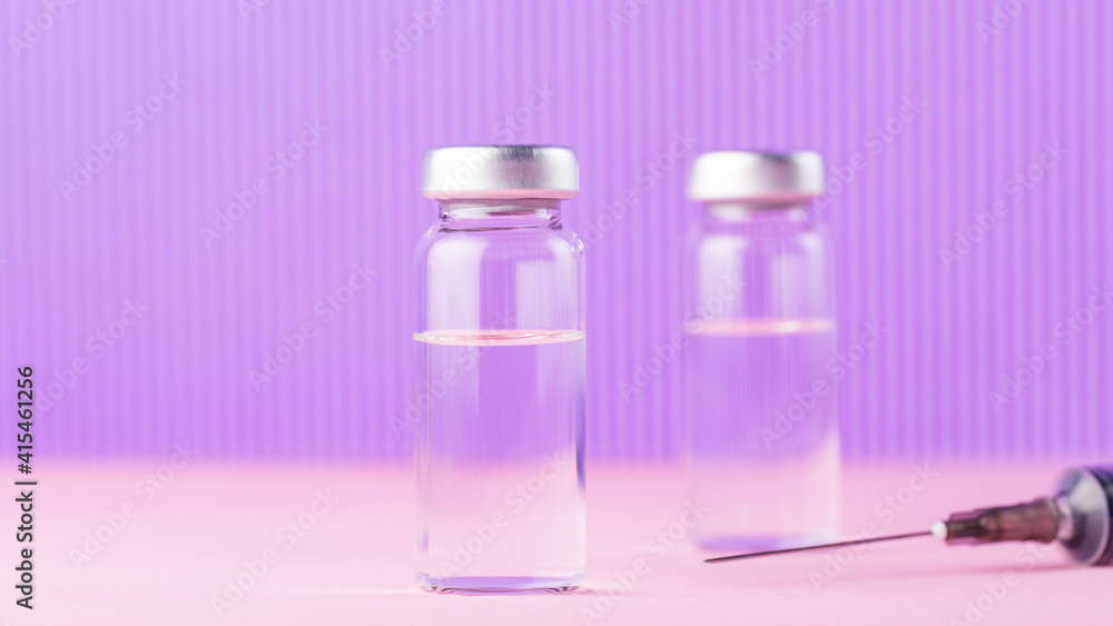 Vaccines and syringe on a pink purple background for prevention and ...