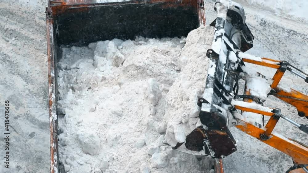 Close-up overhead above view of tractor loader machine snowplow shovel ...