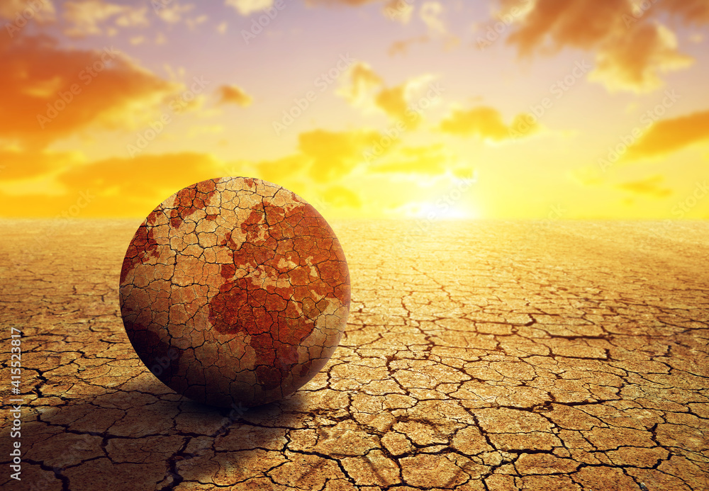 Parched planet earth in the dry landscape with cracked soil at sunset ...
