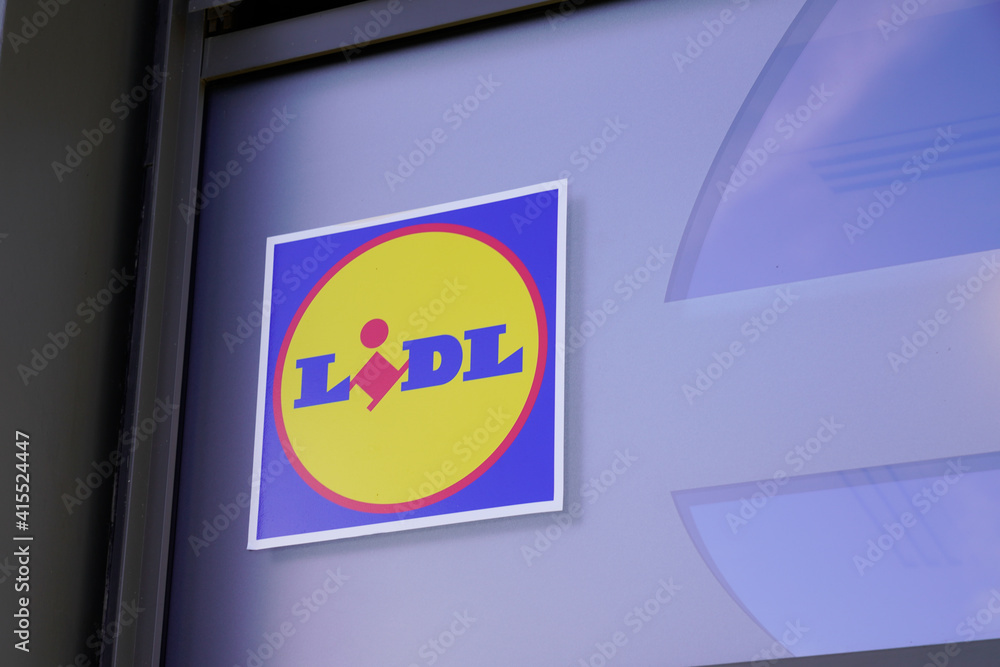 Lidl logo brand and sign text front of store market global hard ...