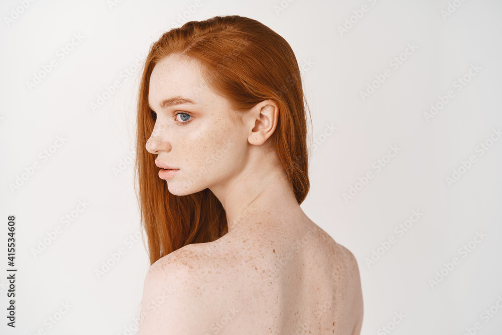 Haircare and skincare concept. Rear view of redhead woman back, turn ...