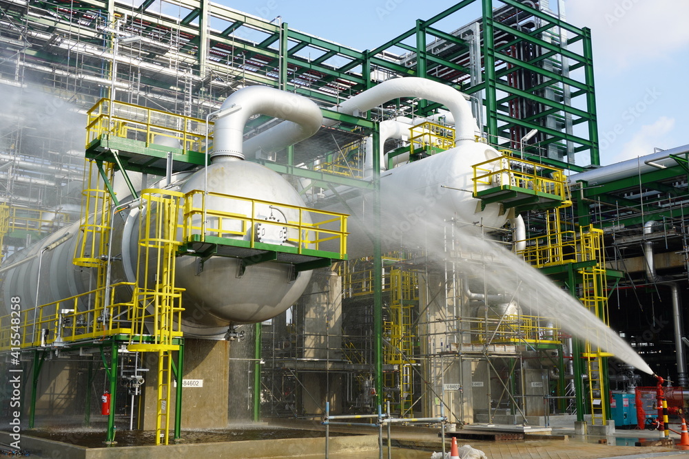 Water flowing vigorously from open fire hydrant as part of the fire ...