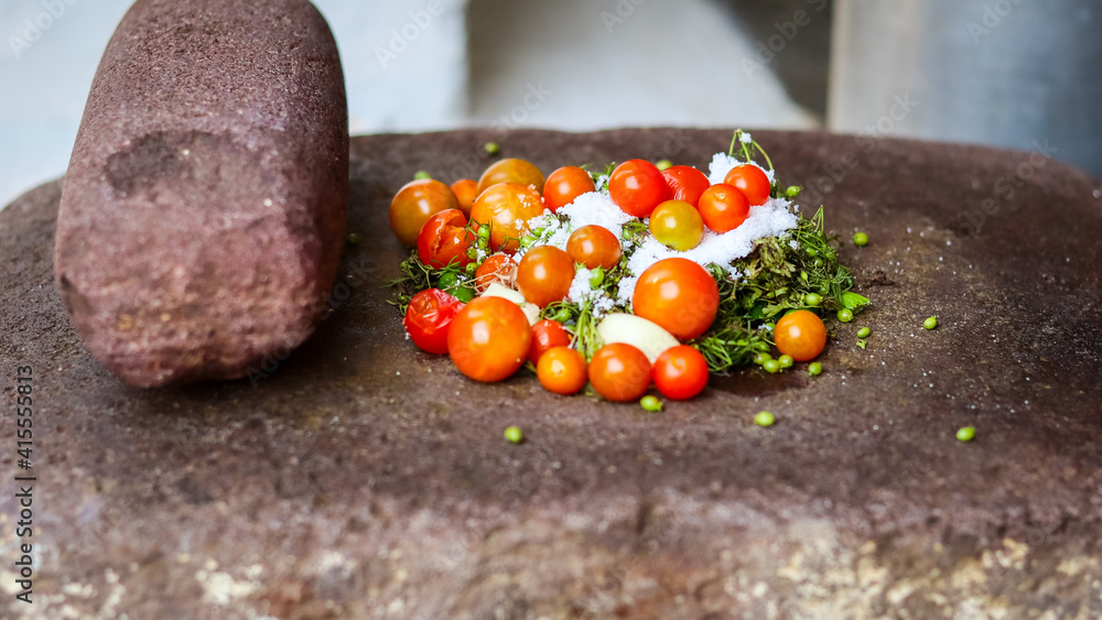 Tomato chutney on grinding stone Stock Photo | Adobe Stock