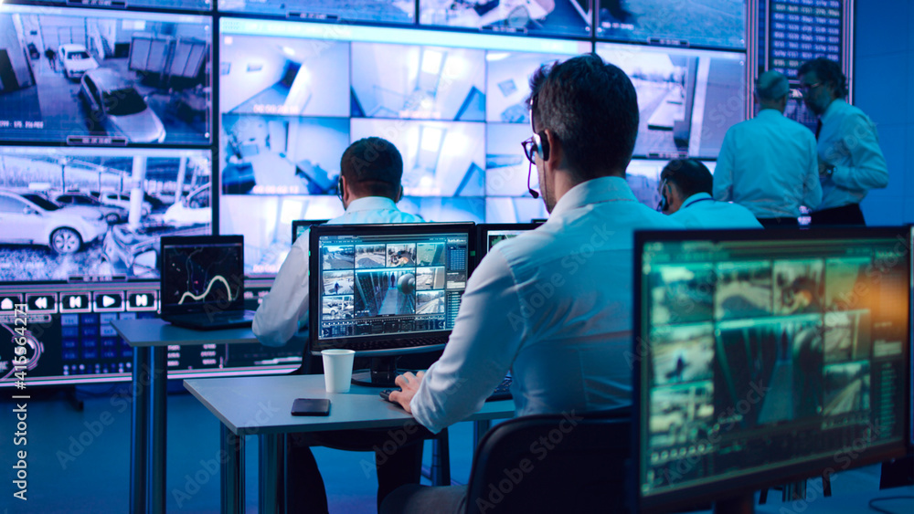 Surveillance team working near talking bosses Stock Photo | Adobe Stock