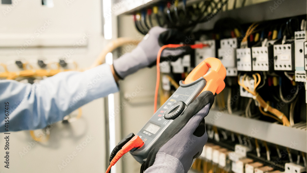 Foto de Electrical engineers test electrical installations and wiring ...