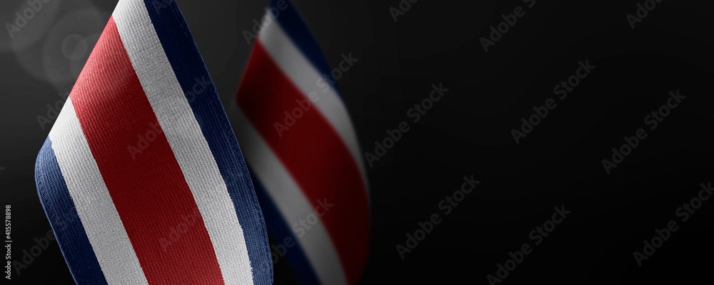 Small national flags of the Costa Rica on a dark background Stock Photo ...