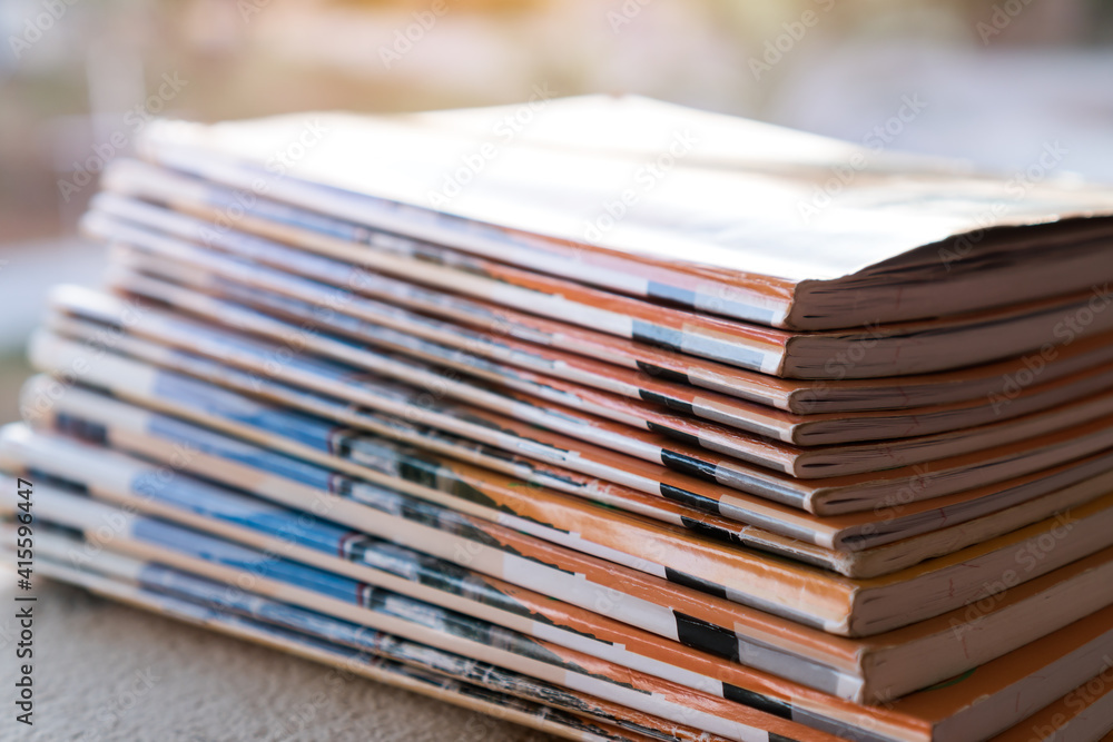 Files stacking messy student homework books on teacher desk in school ...