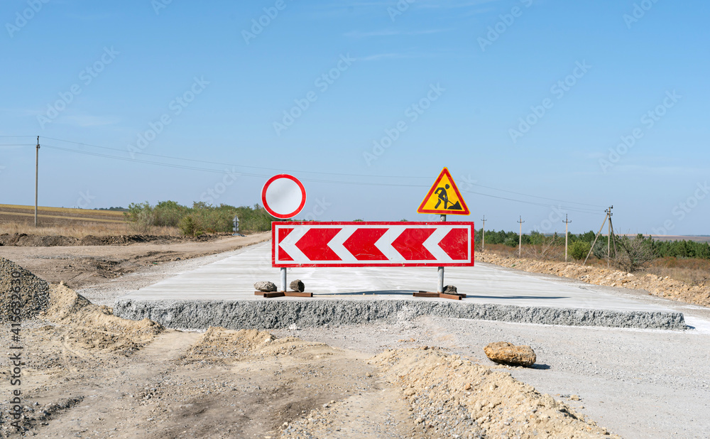 Road signs and construction of a new highway Stock Photo | Adobe Stock