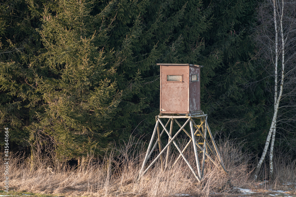 Wooden lookout tower for hunting in the woods and on meadow Stock Photo ...