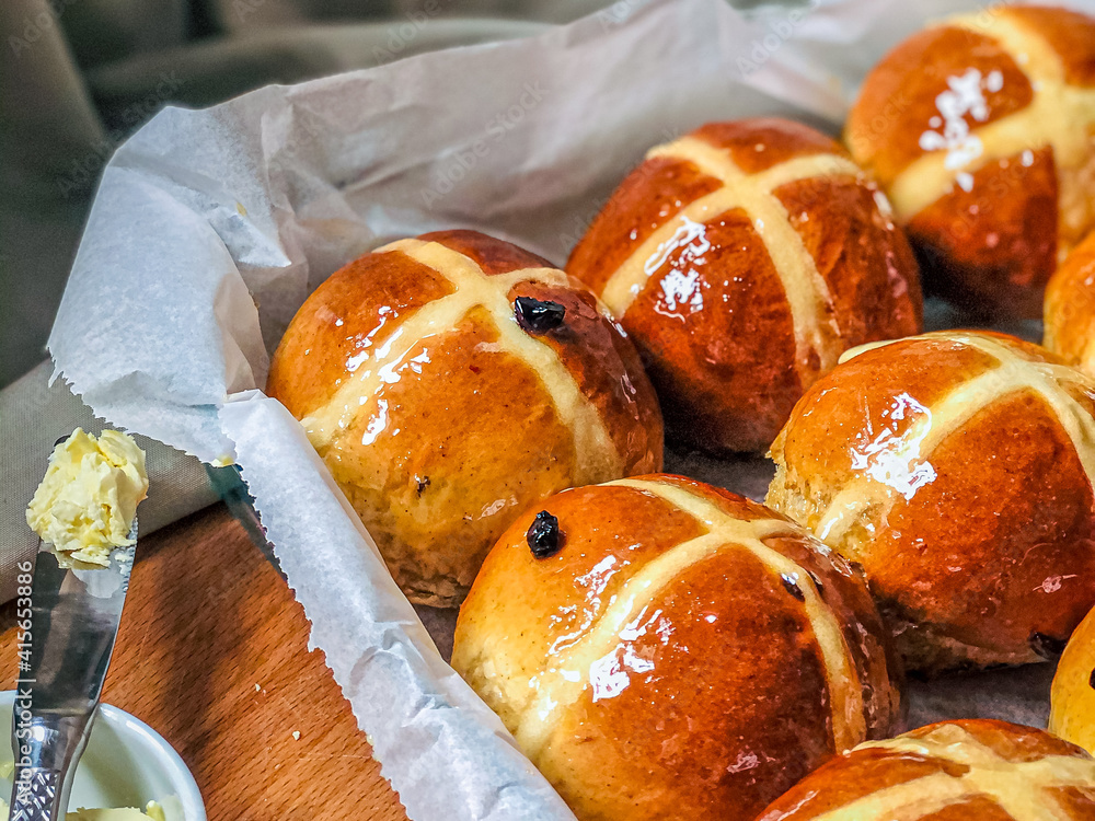 Homemade Hot Cross Buns. A spiced sweet bun made with fruit, marked ...