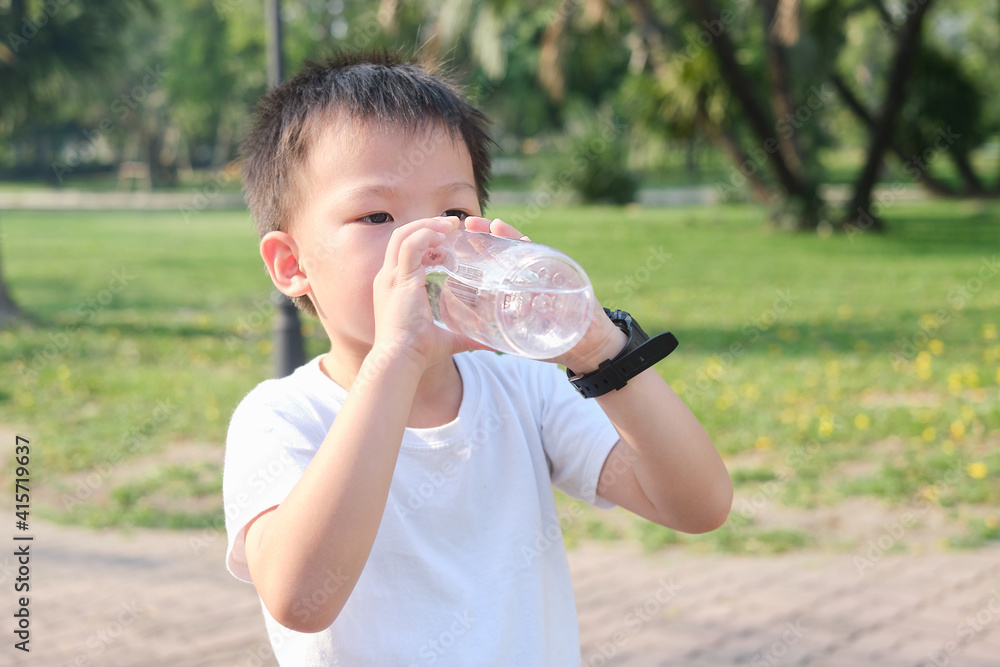 Cute little Asian 5 years old boy child drinking pure water from ...