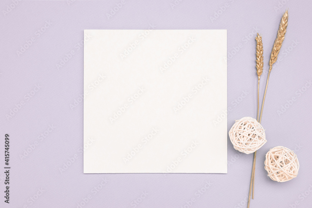 Square invitation card mockup with dried golden ears on a neutral color ...