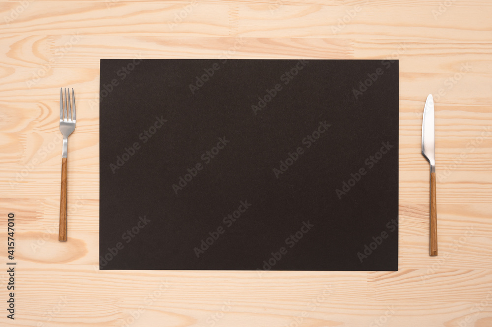 Mockup Blank black card and cutlery. Knife and fork with black paper a4 ...