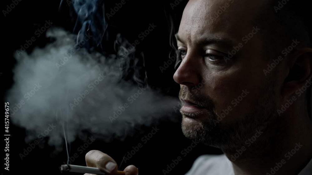 Man smoking a cigarette and blowing smoke out of his mouth. Isolated on ...