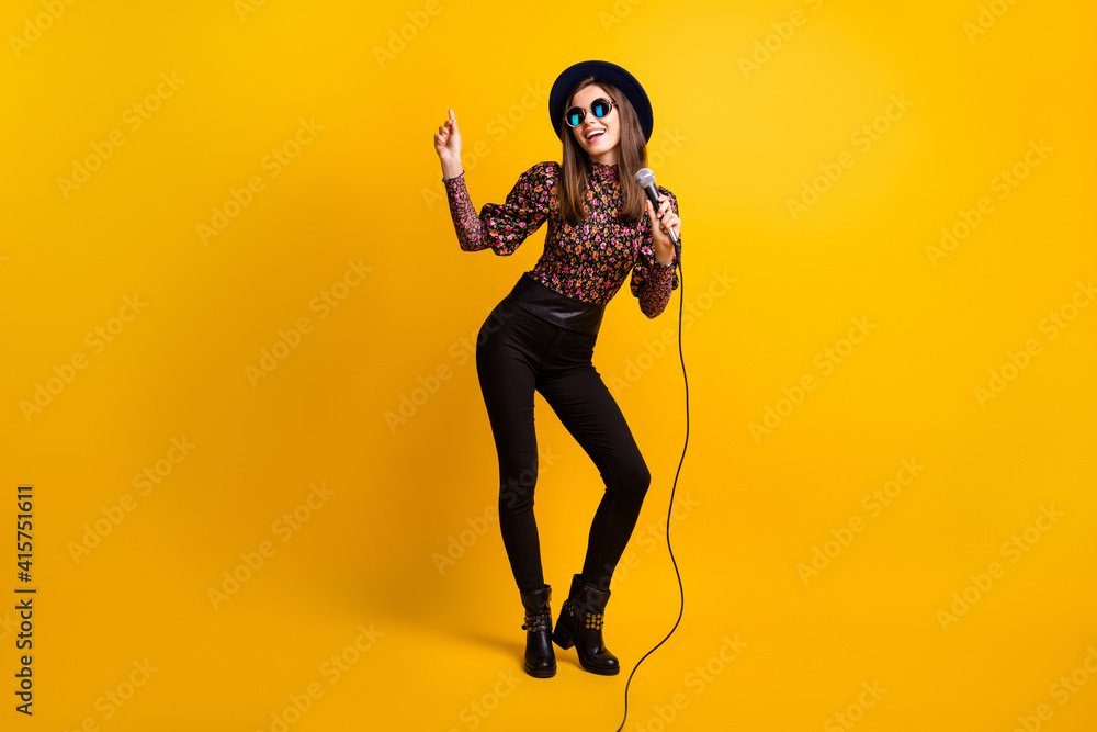 Full length body size photo of pop star keeping microphone dancing ...