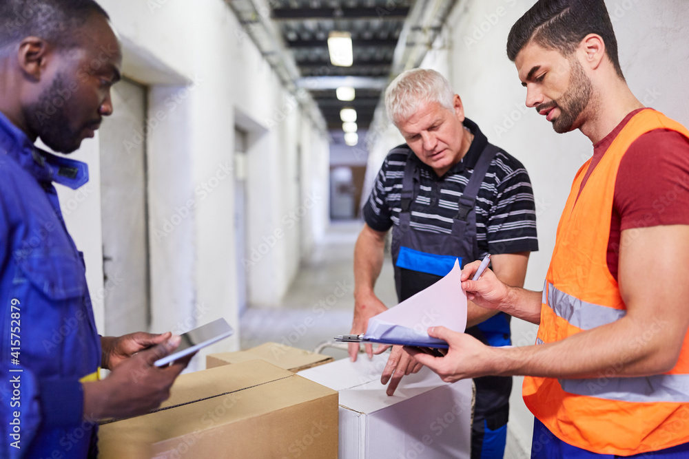 Checking A Delivery Of Goods With A Checklist Stock Photo Adobe Stock