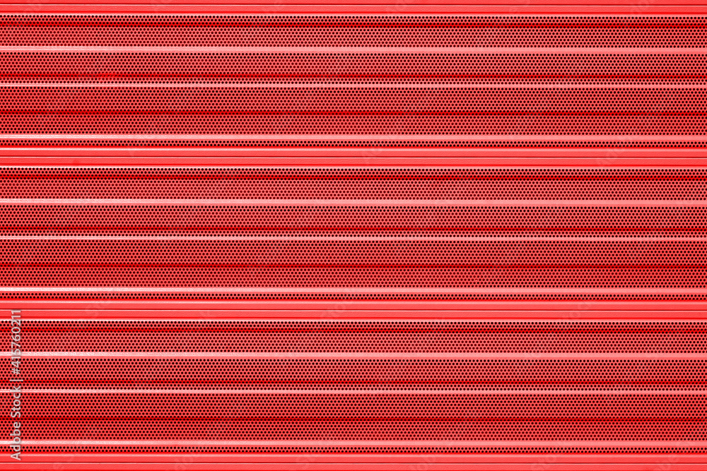 Perforated metal sheet texture. Stainless steel security wall. Red ...