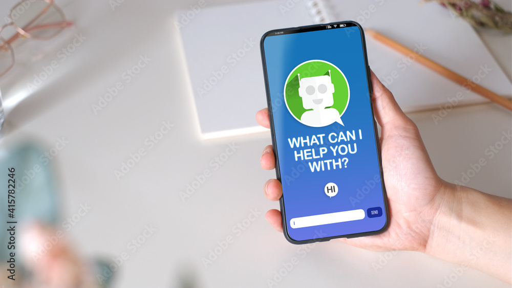 close up hand chat with chatbot on mobile app.top view holding mobile ...