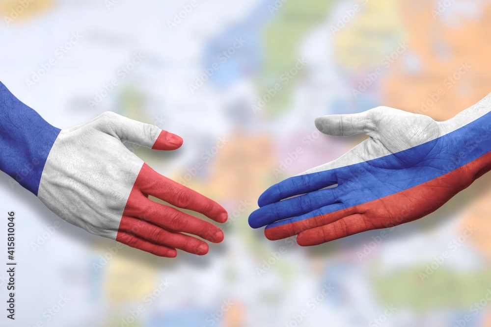 Russia and France - Flag handshake symbolizing partnership and ...