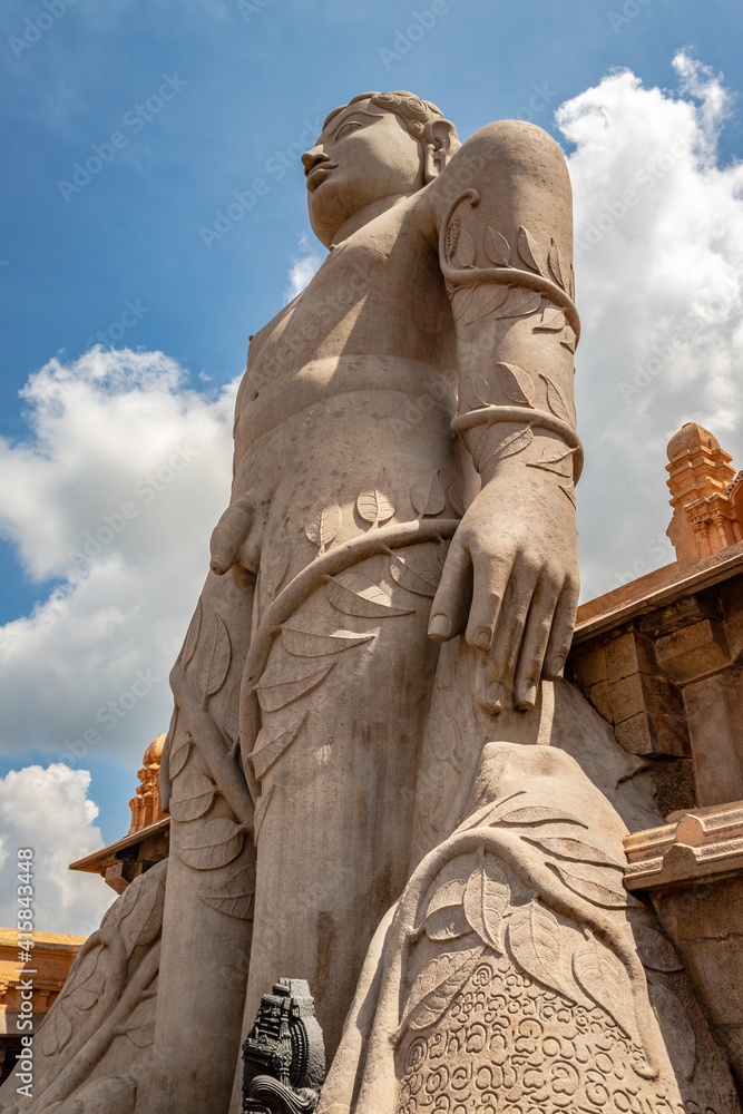 idol of a deity stone statue symbolizing Peace in Jainism with blue sky ...
