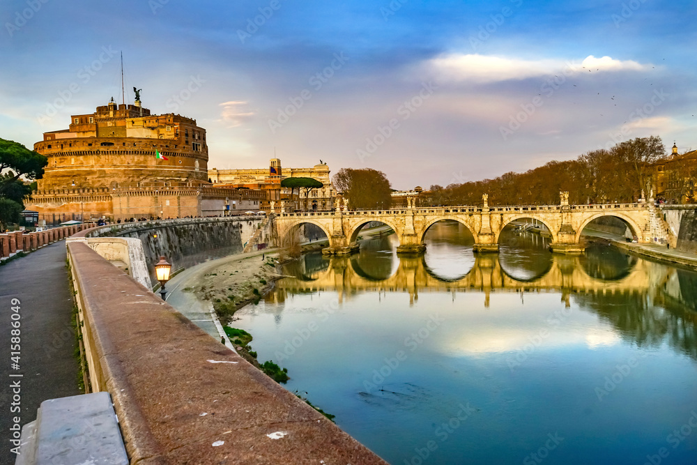 Red wall of St. Angelo Bridge, Tiber River reflection, Rome, Italy ...