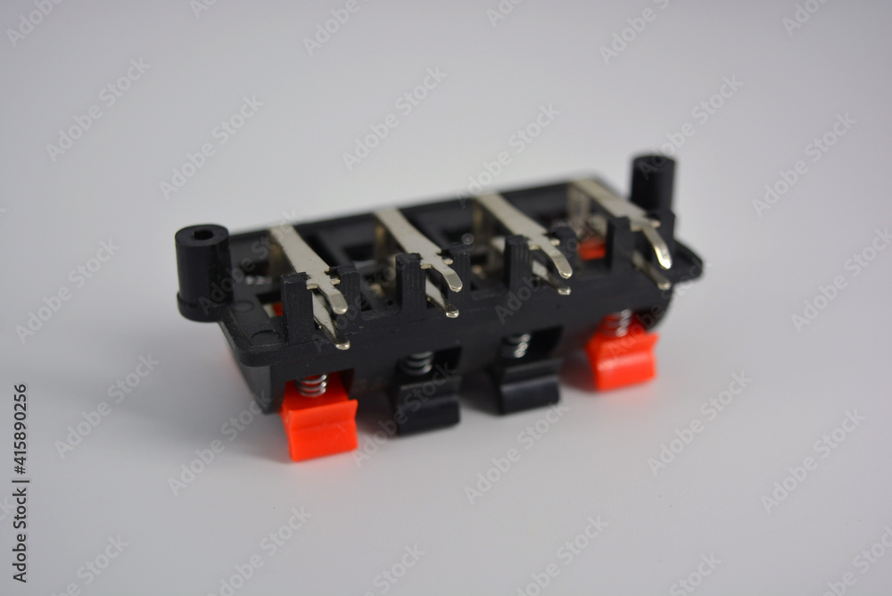 Black electric plastic box for fixing wires with red and black clamps ...