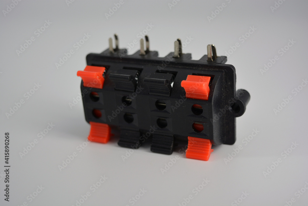 Black electric plastic box for fixing wires with red and black clamps ...