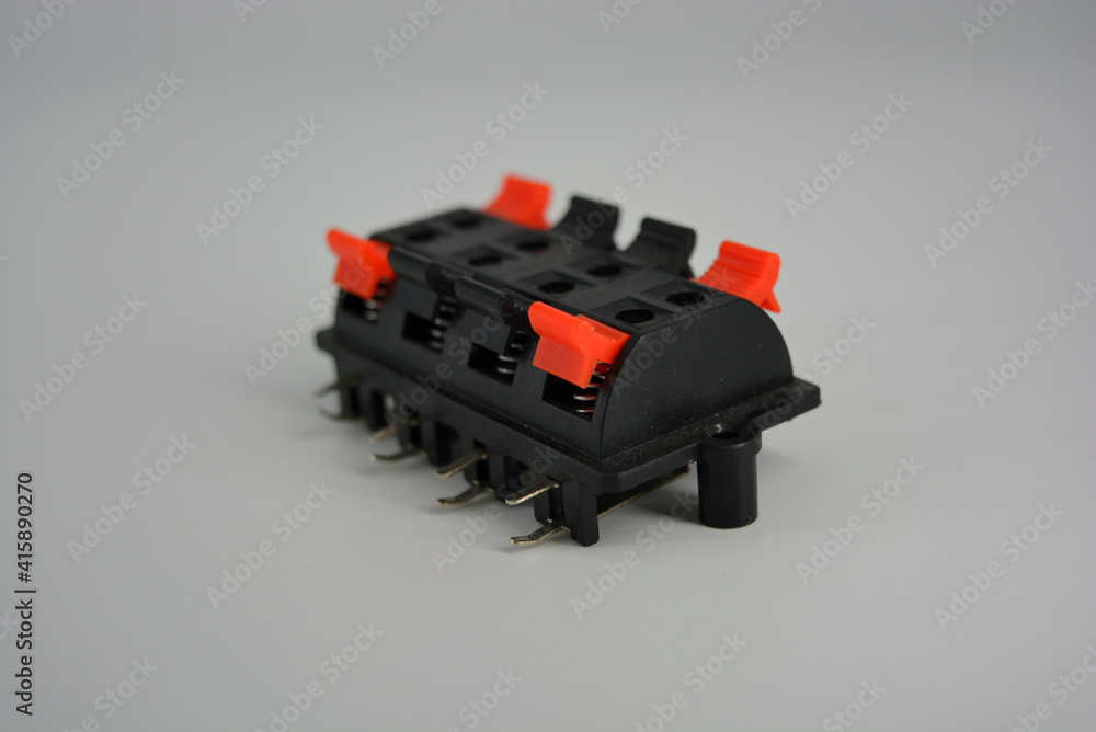 Black electric plastic box for fixing wires with red and black clamps ...