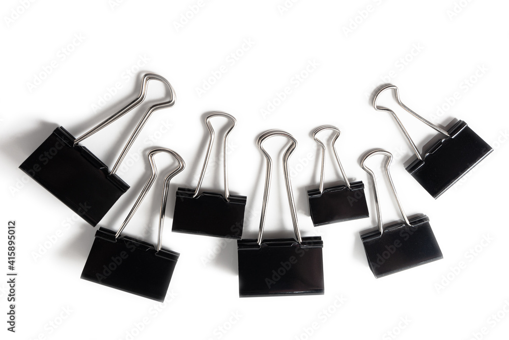 Black paper clips for paper documents clamping. Office metal foldback ...