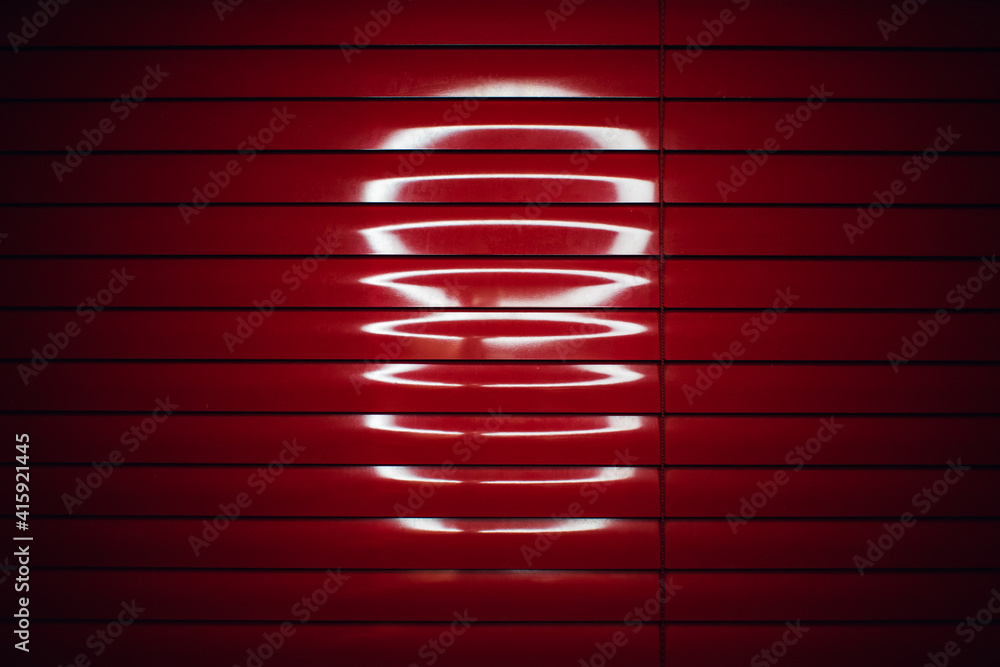 Closed red jalousie with dark edges for background and texture usage ...