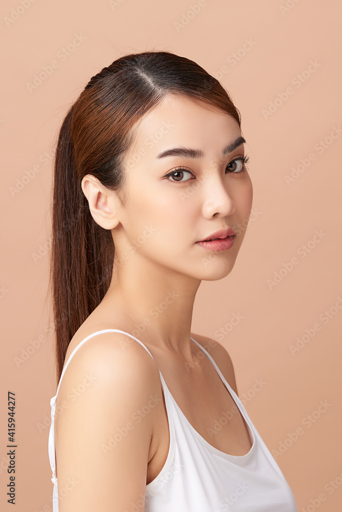Beautiful young asian woman with clean fresh skin on white background ...