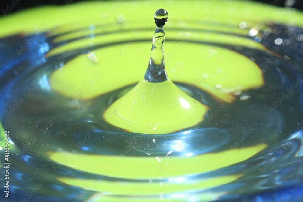 splash of water after falling drops, stop motion, dripping water into a ...