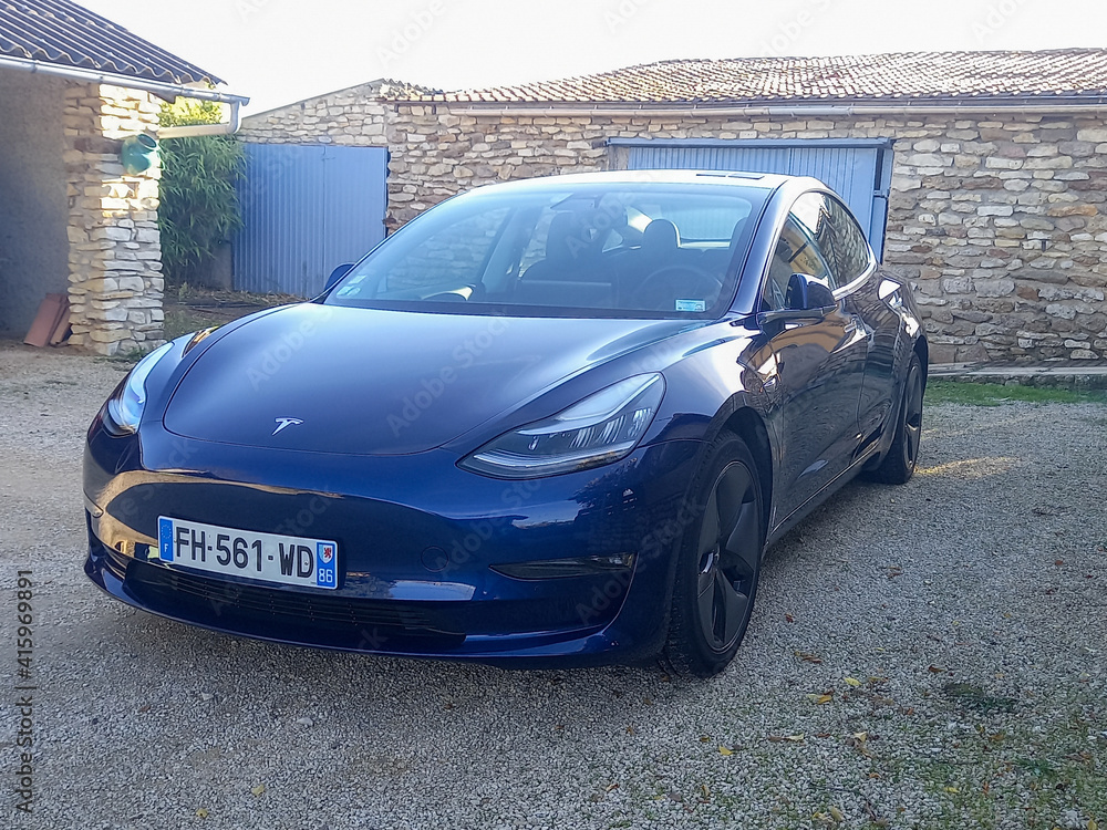 tesla model 3 car parked in outdoor home electric vehicle automotive ev ...