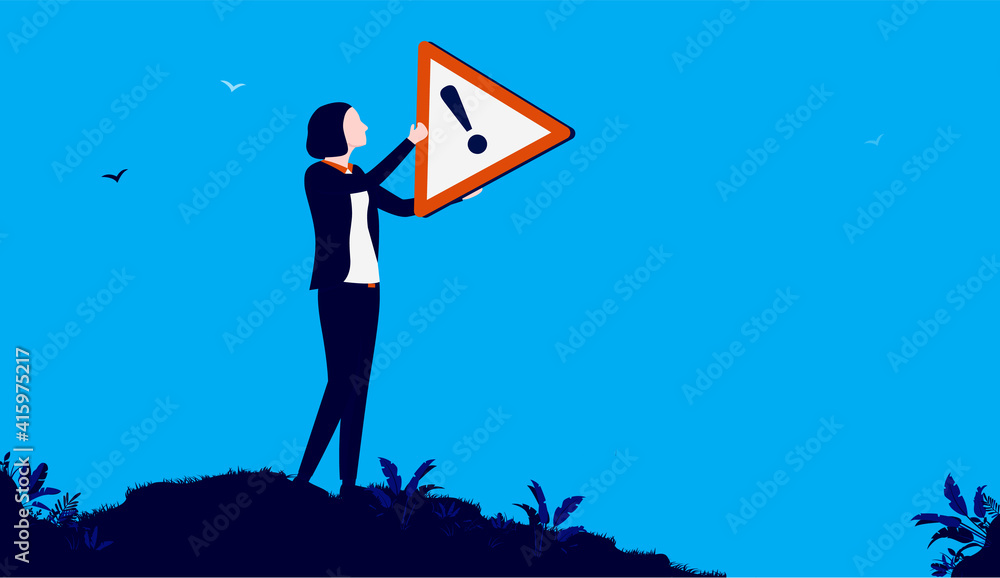 Businesswoman with warning sign - Woman holding a sign of danger in ...