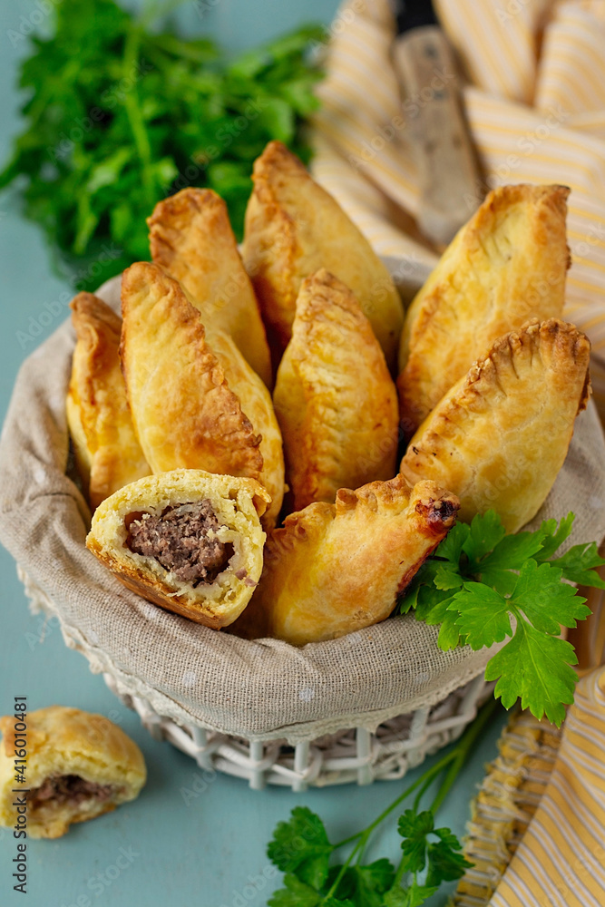 Traditional Lithuanian savoury pastries Kibinai filled with ground meat ...