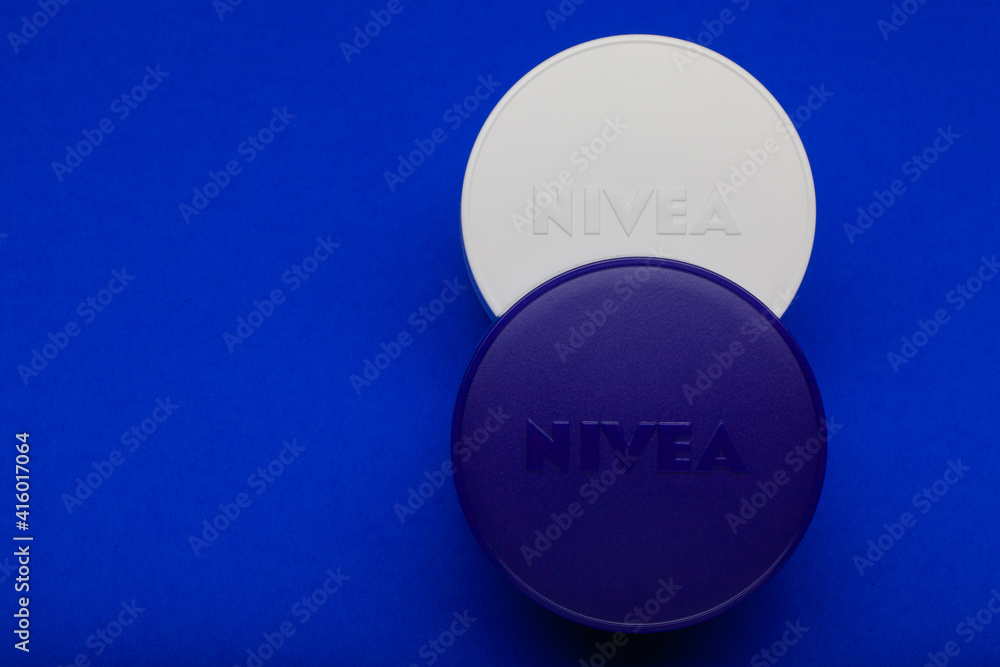 Nivea Day and Night Creme on the blue background. Stock Photo | Adobe Stock