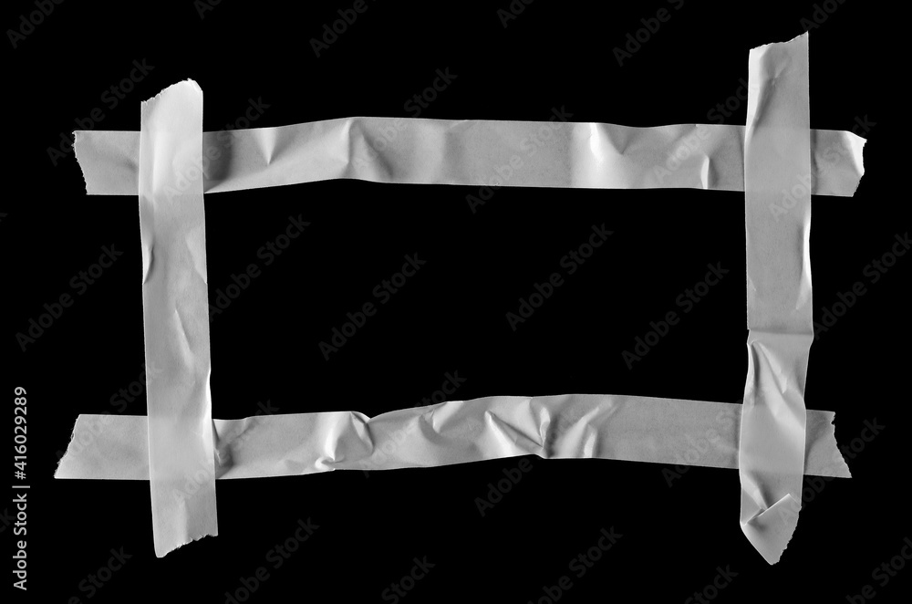 Blank white paper tape frame and border isolated on black background ...